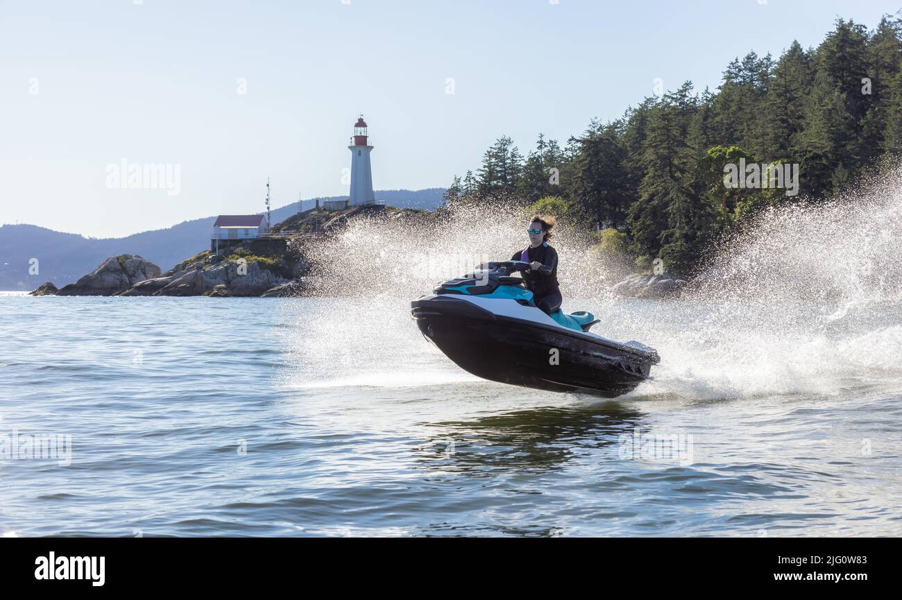 Adventurous Caucasian Woman on Sea-Doo riding in the Ocean Stock Photo ...