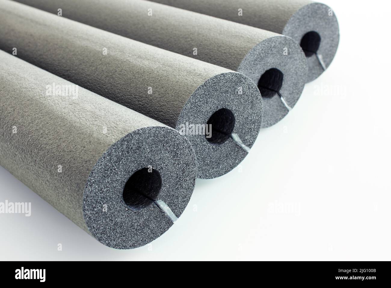 Water pipe and heating pipe insulation on white background closeup ...