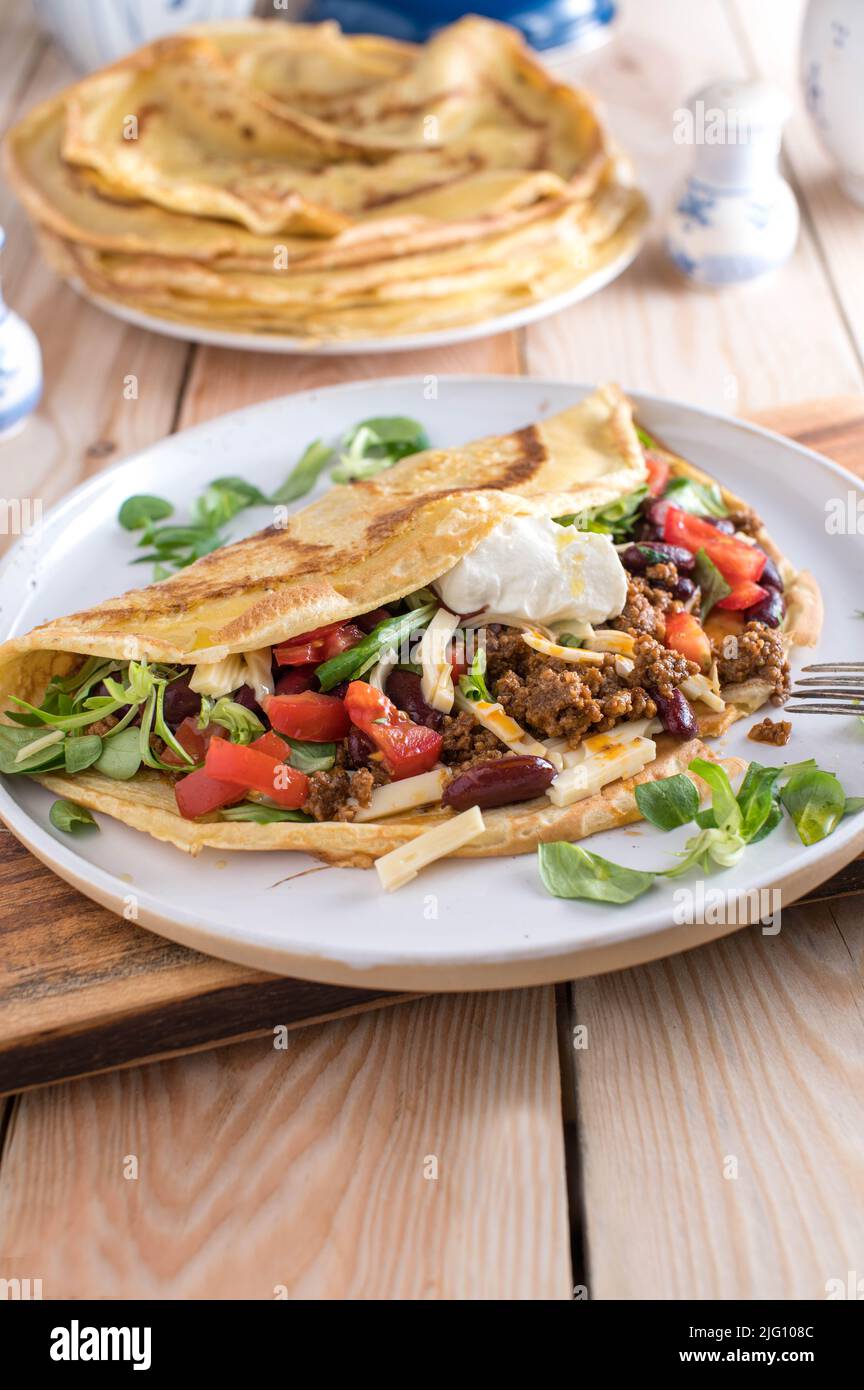 Savory pancake dish or crepe filled with spicy ground beef, kidney ...