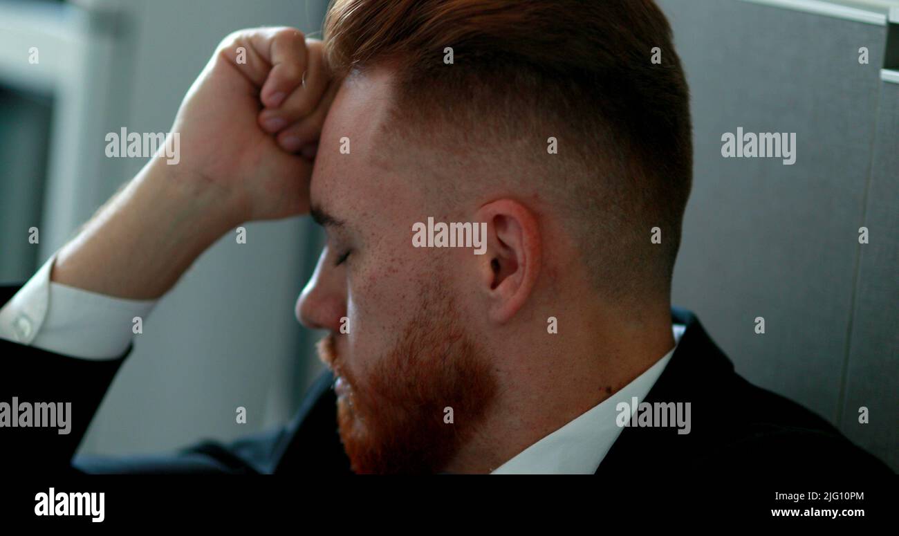 Pensive business man sitting on floor in frustration Stock Photo - Alamy