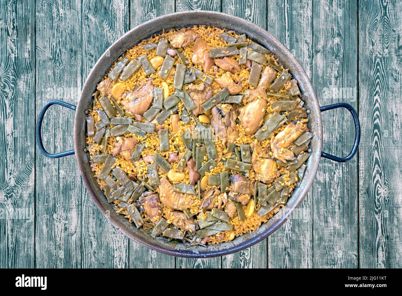 Original Valencian paella made with rice, chicken, rabbit, green beans ...