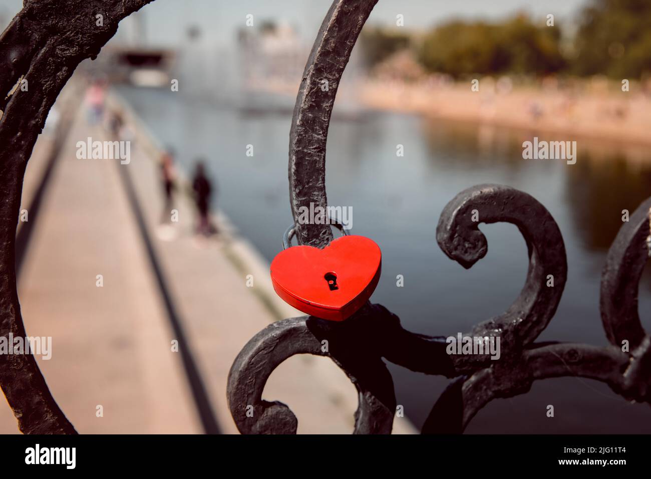 red heart lock on the railing of the bridge Stock Photo - Alamy