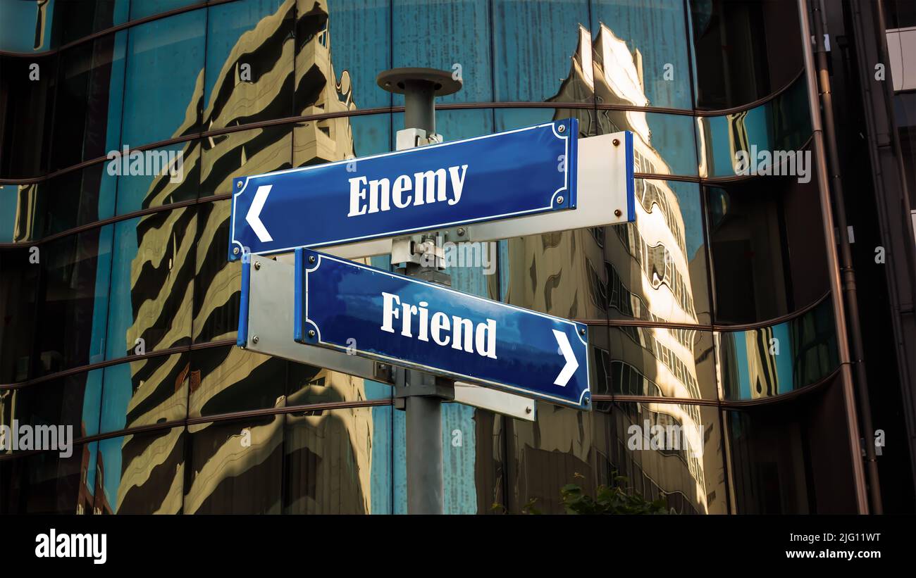Street Sign the Direction Way to Friend versus Enemy Stock Photo - Alamy