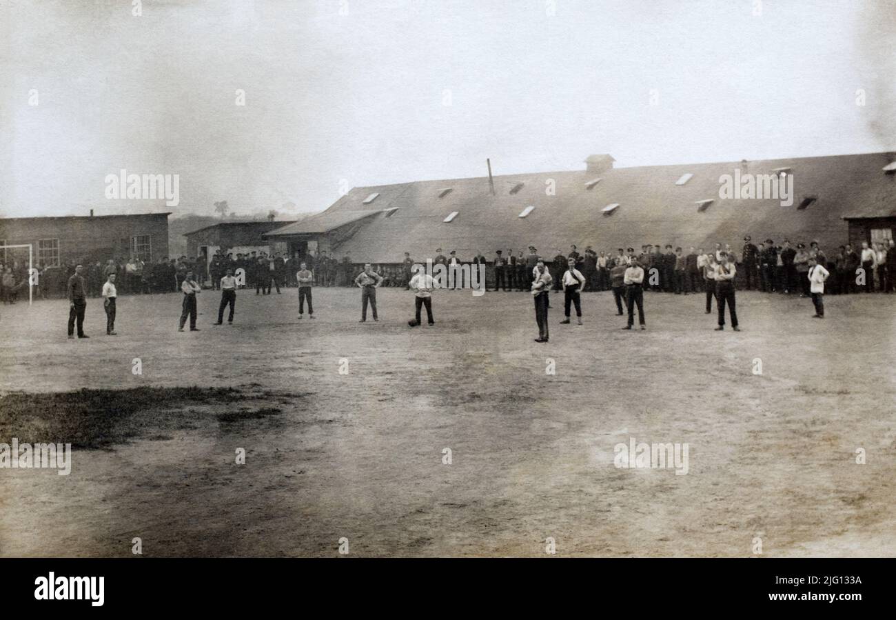 British army soldiers playing and watching a game of football during ...
