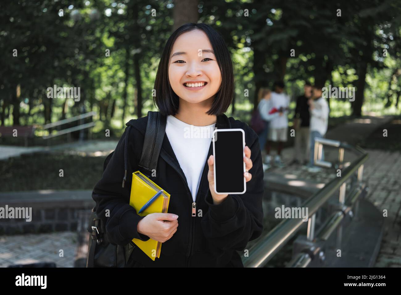 Cheerful asian student book hi-res stock photography and images - Alamy