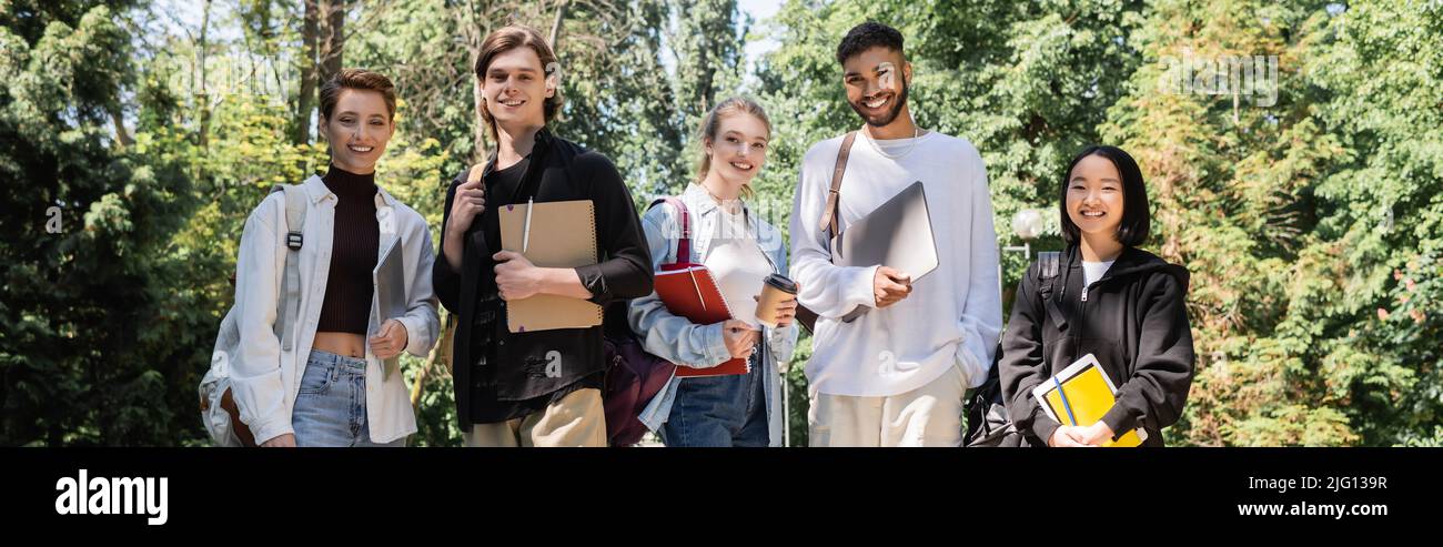 Group friends pose camera in hi-res stock photography and images - Alamy