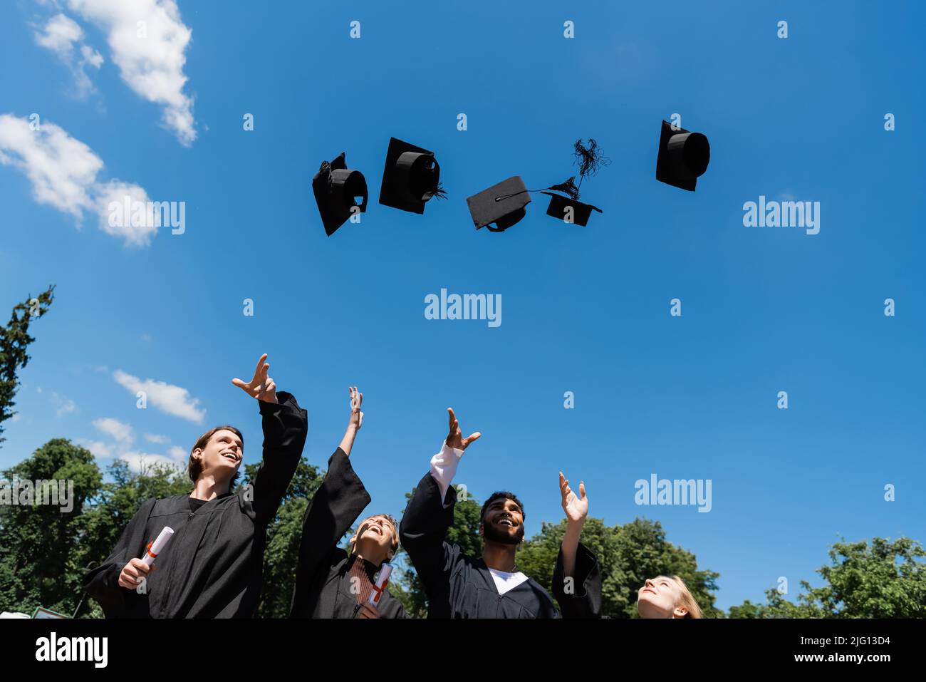Graduates throwing caps black hi-res stock photography and images - Alamy