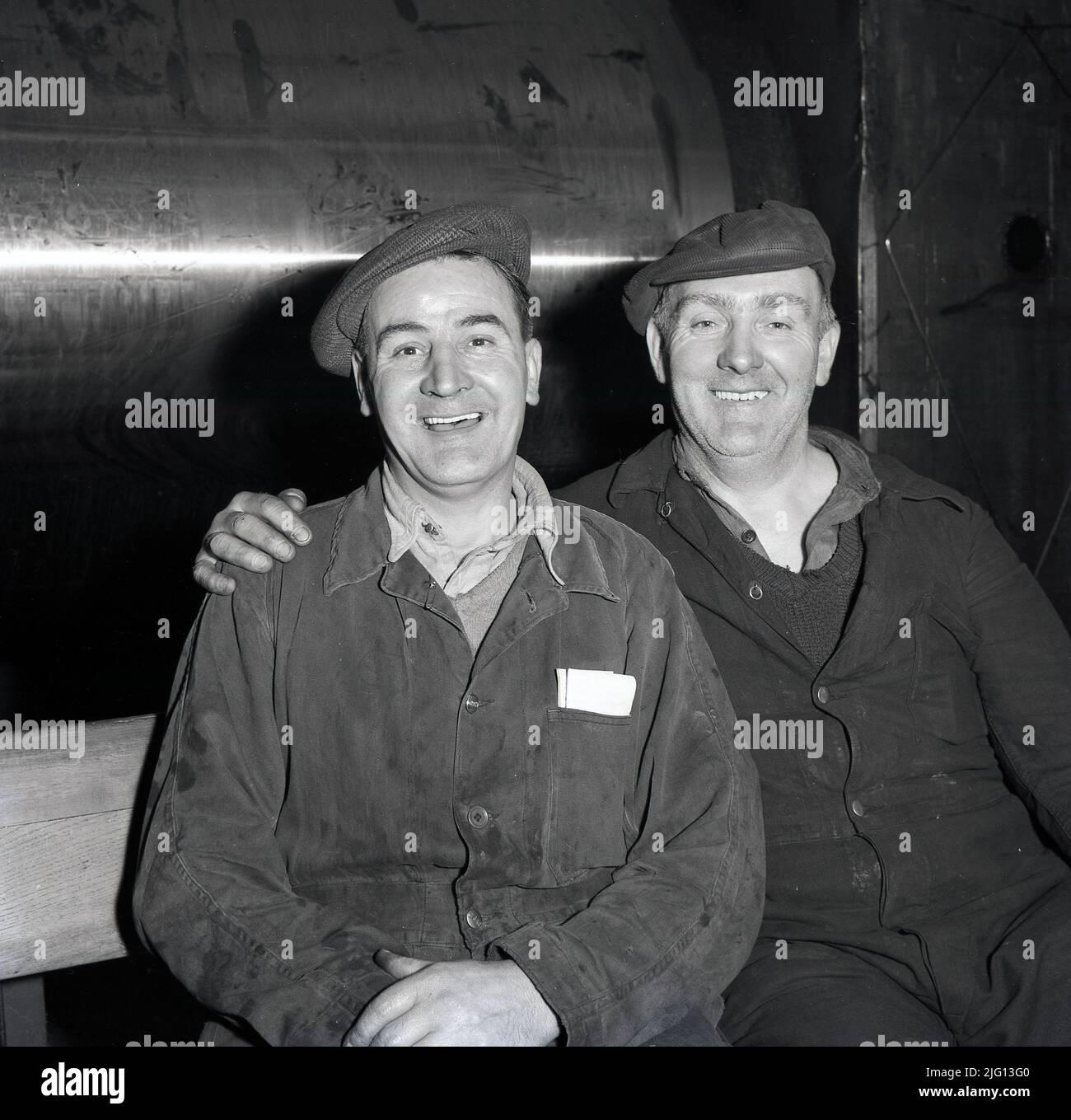 1950s, historical, two Welsh steel workers sitting for their photo ...