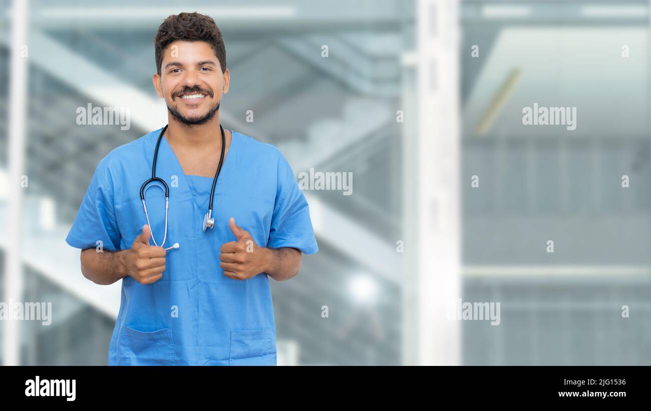 Successful hispanic male nurse with beard at clinic Stock Photo - Alamy