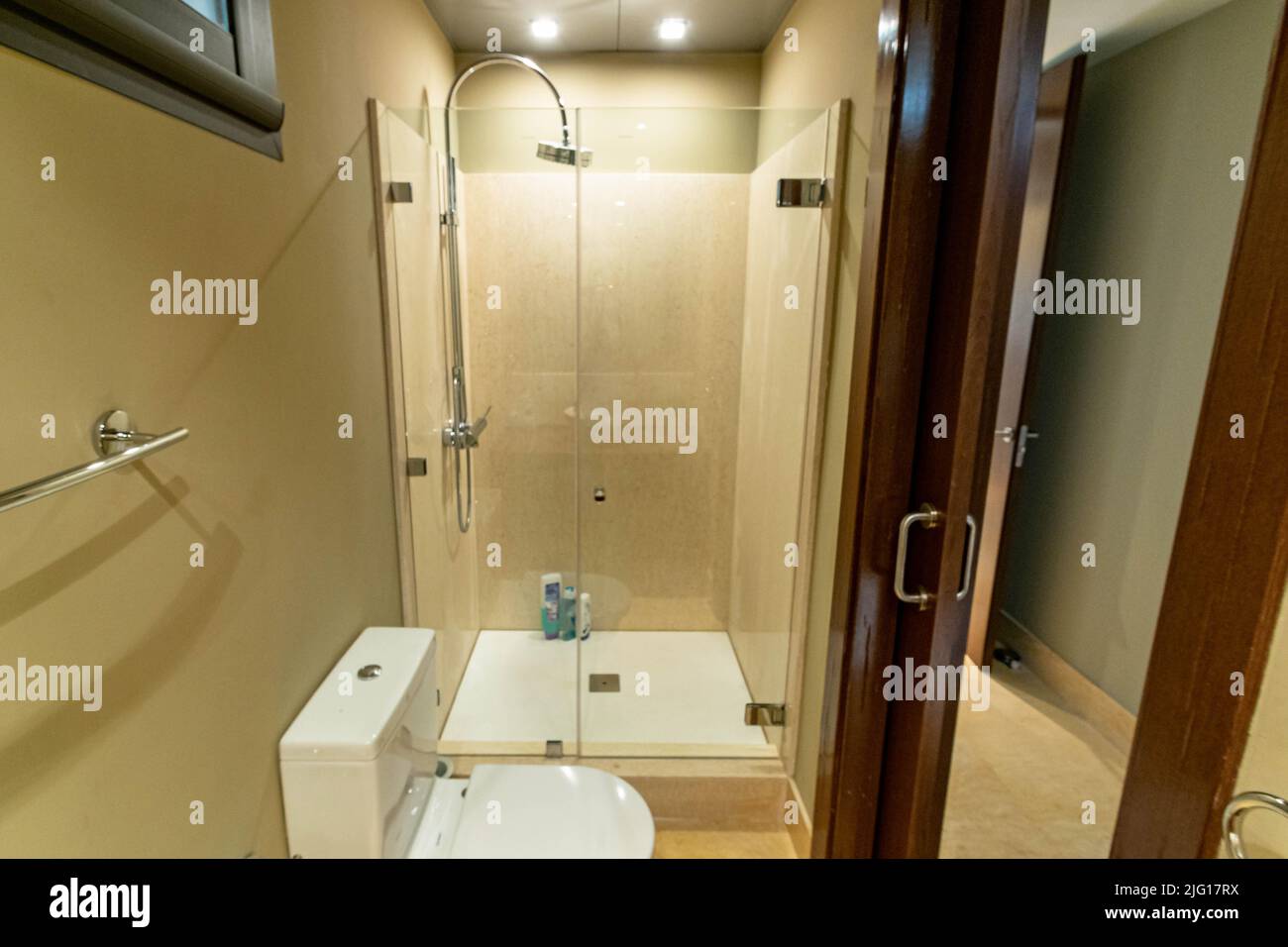 a standing shower inside one the bathrooms inside an apartment along ...
