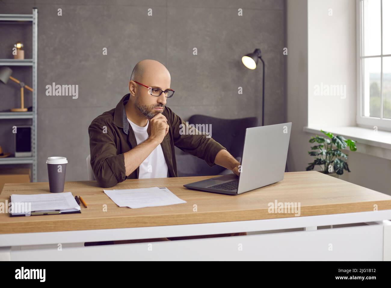 Serious employee working on go hi-res stock photography and images - Alamy