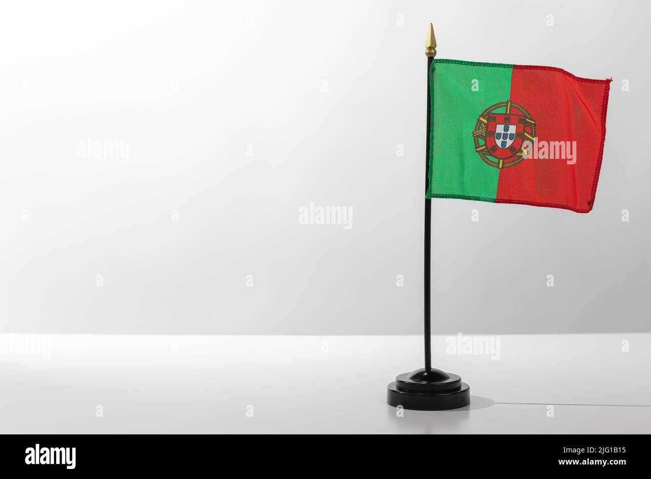Flying Country Flag Portugal isolated on white table with a grey ...