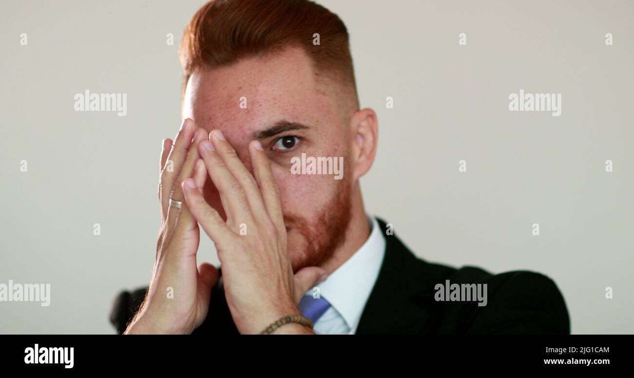 Perplexed man reaction with unbelief emotion. Person hiding face with ...