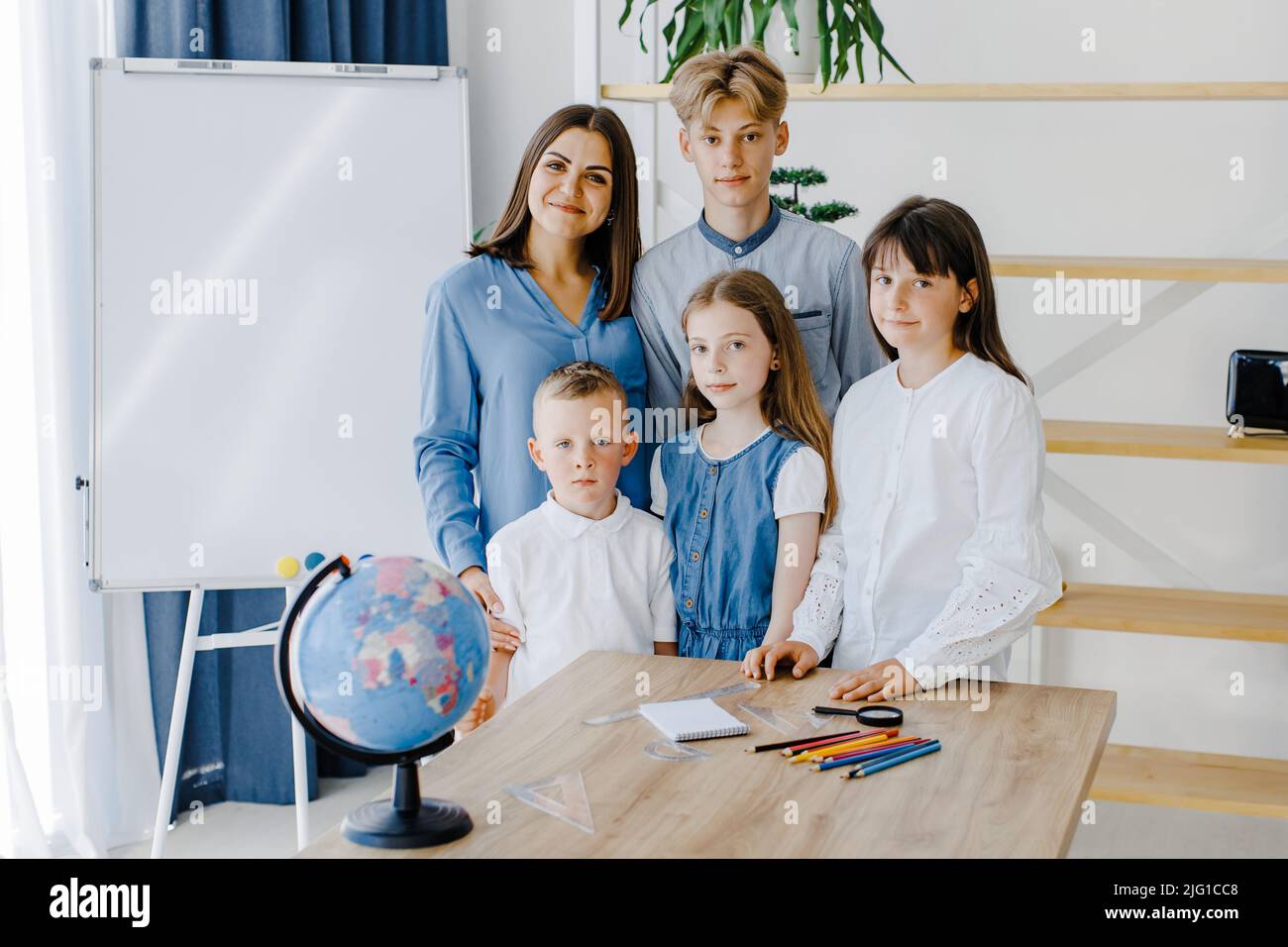 Teacher schoolchildren different ages hi-res stock photography and ...