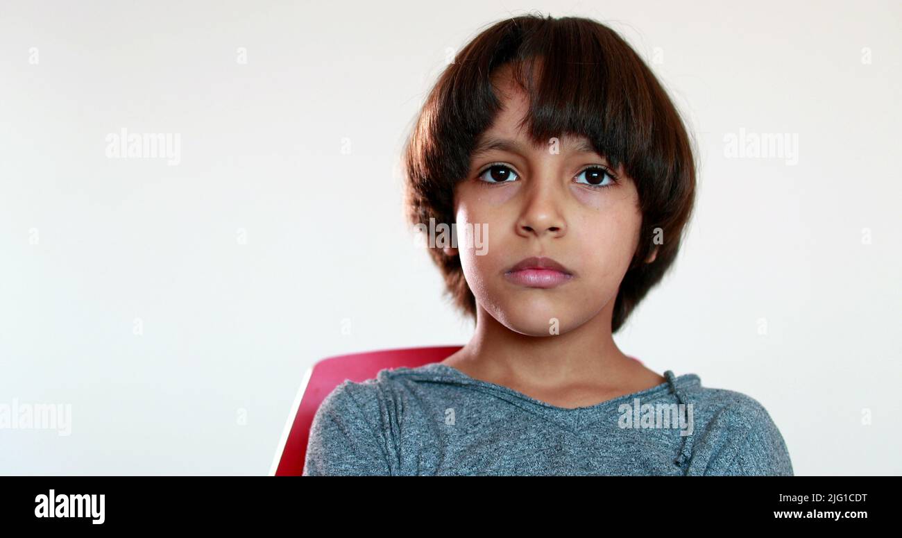 Portrait thoughtful child mixed race kid thinking contemplation Stock ...