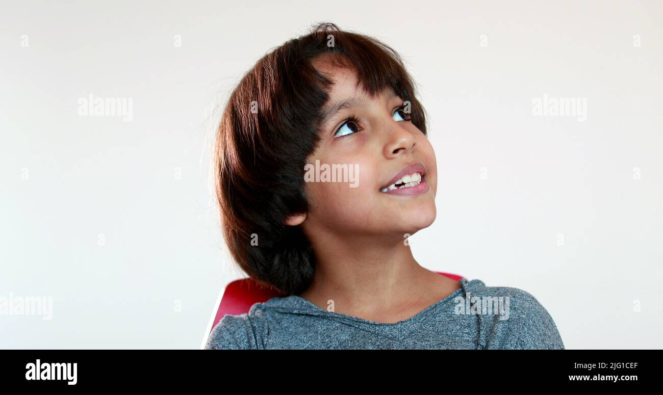 Portrait thoughtful child mixed race kid thinking contemplation Stock ...