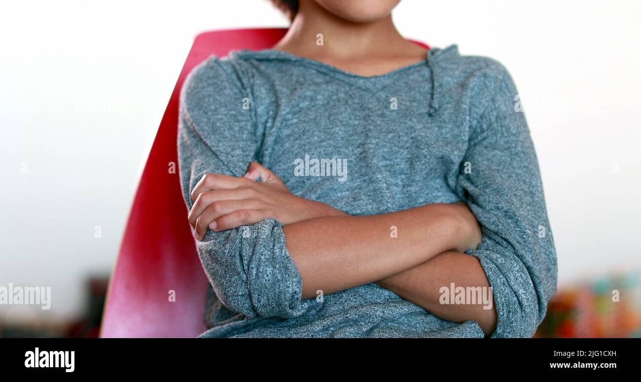 Upset child crossing arms feeling offended, angry kid, african descent ...