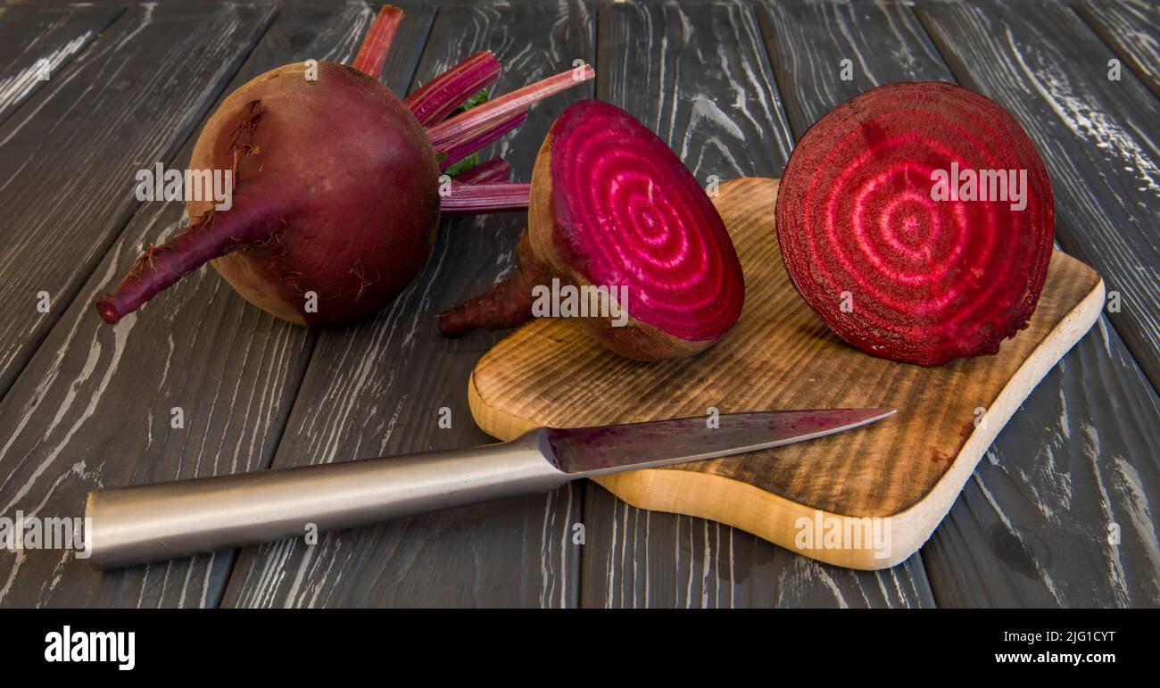 Red beets on a cutting board with a knife Stock Photo - Alamy
