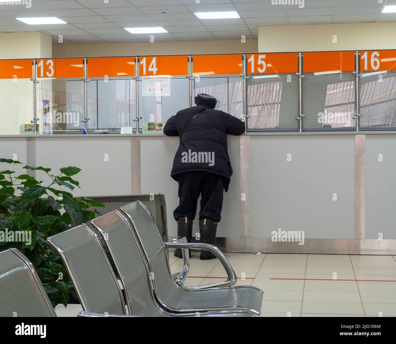 The man at the checkout. Service in a booth at the reception of ...
