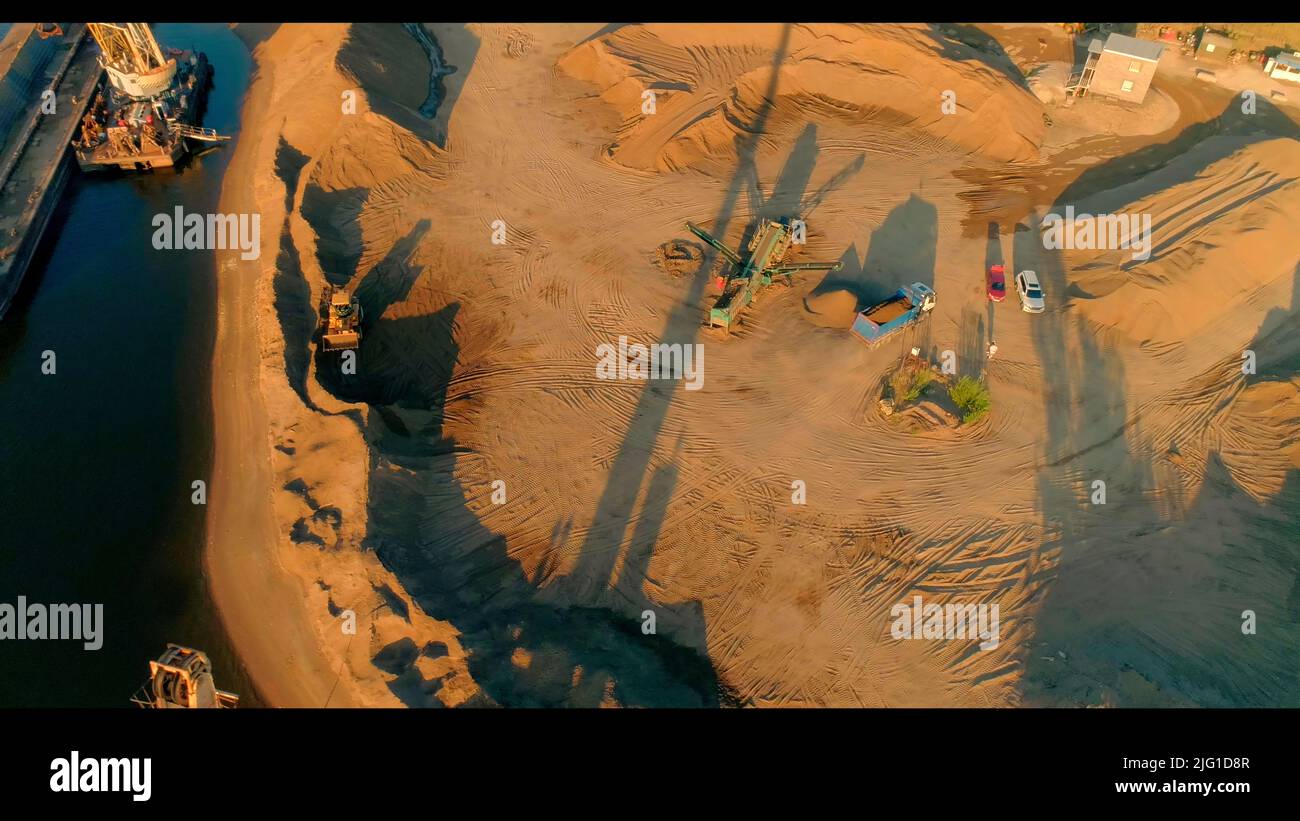 Bird's-eye view. Scene.Large trucks on an empty desert terrain ...