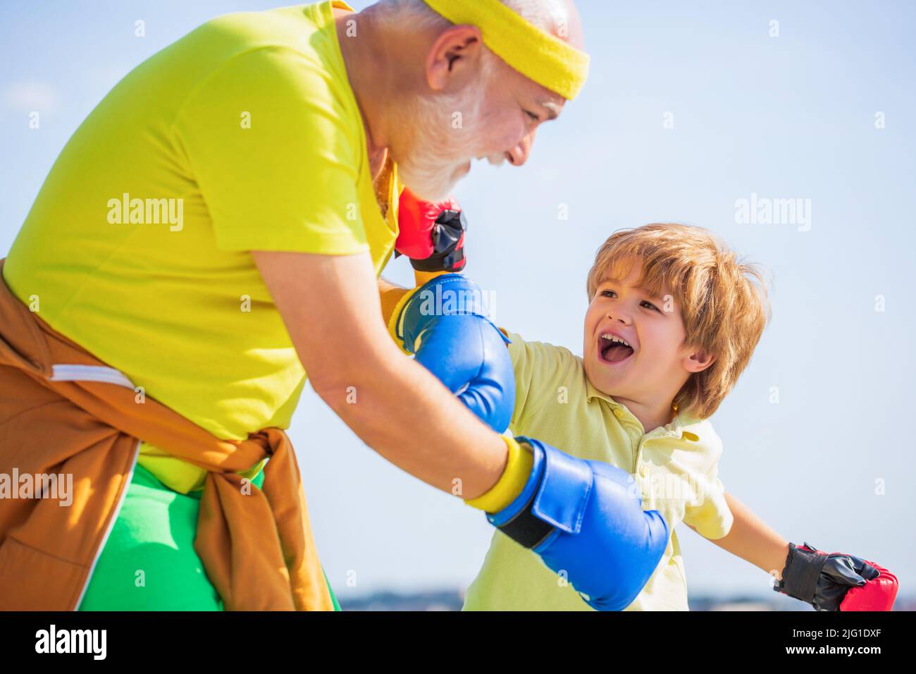 Little boy sportsman at boxing training with coach. Sports man coaching ...