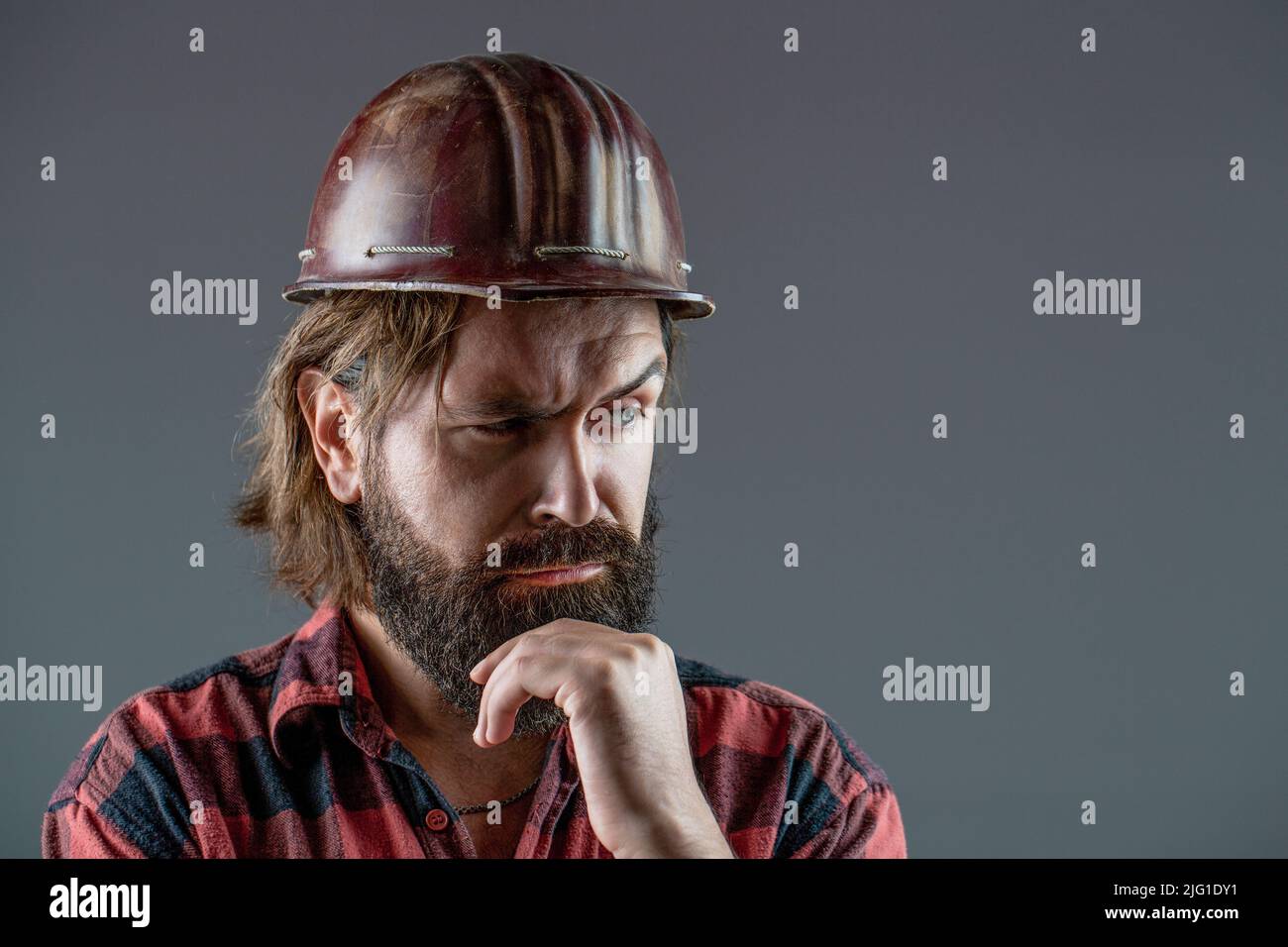 Bearded man worker with beard in building helmet or hard hat. Builder ...