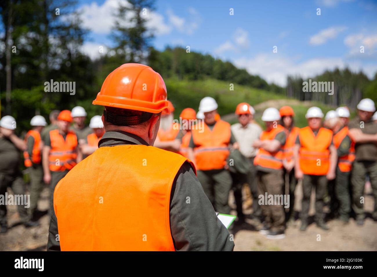 Helmet builder. Many construction workers helmet. Engineer team in ...