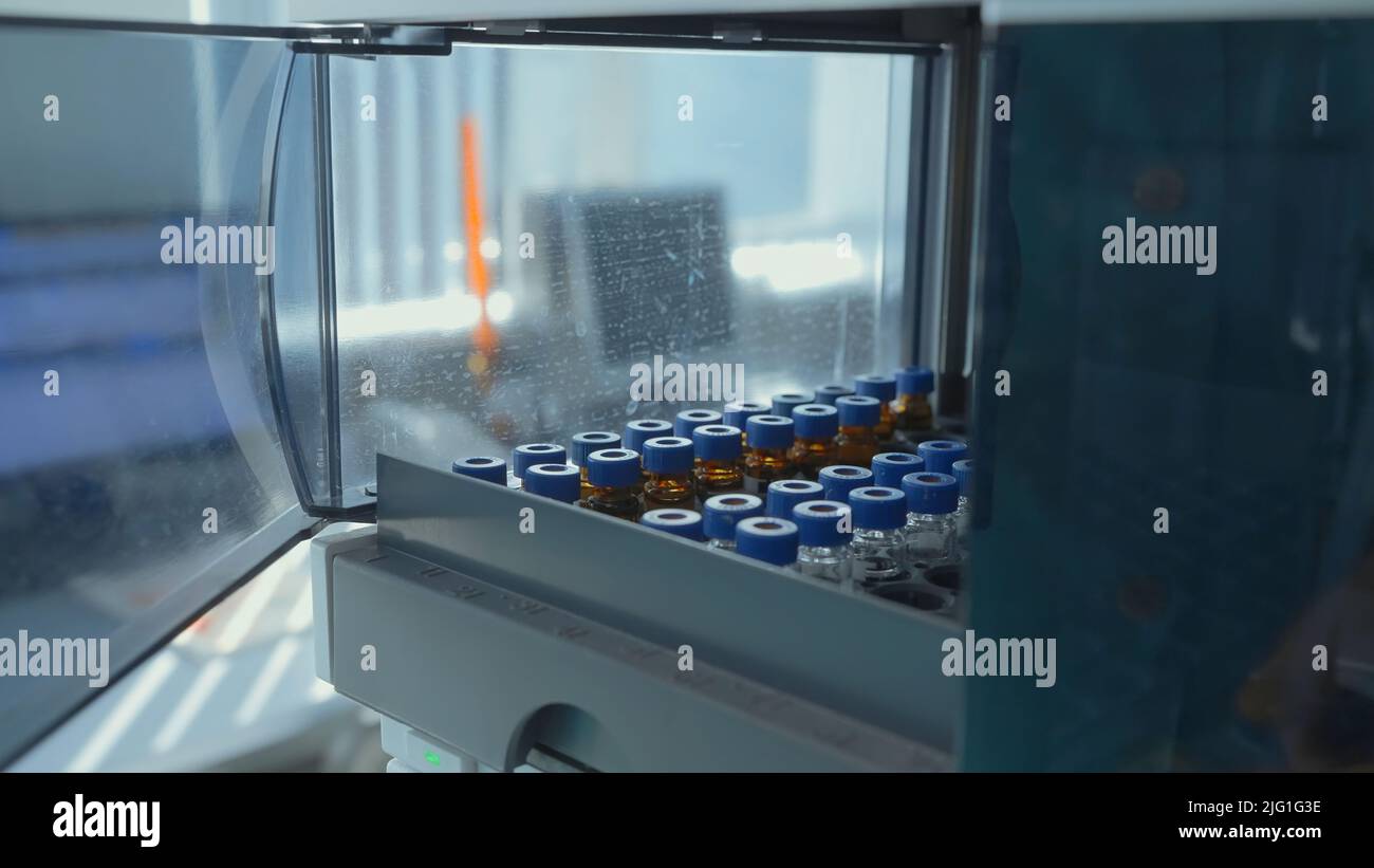 View inside of a laboratory and a scientist making tests. Action ...