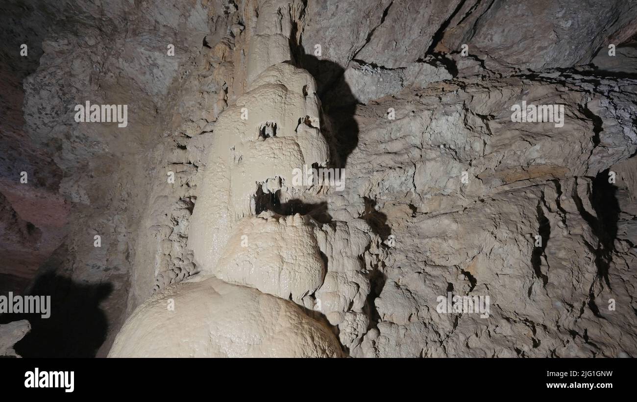 Underground cave formations of stalactites and stalagmites. Action ...