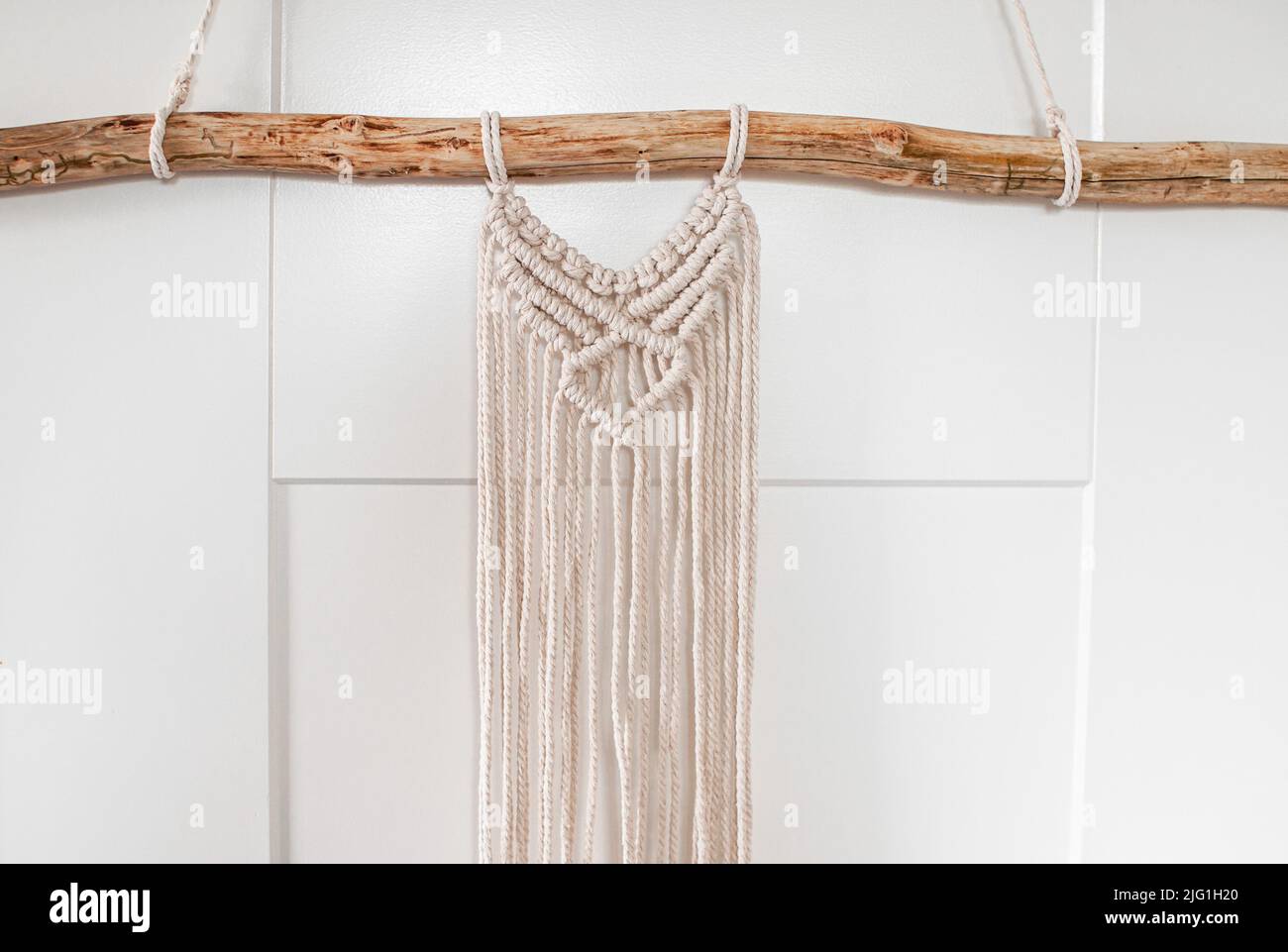 Part of wall decor made of woven threads in the style of macrame on ...