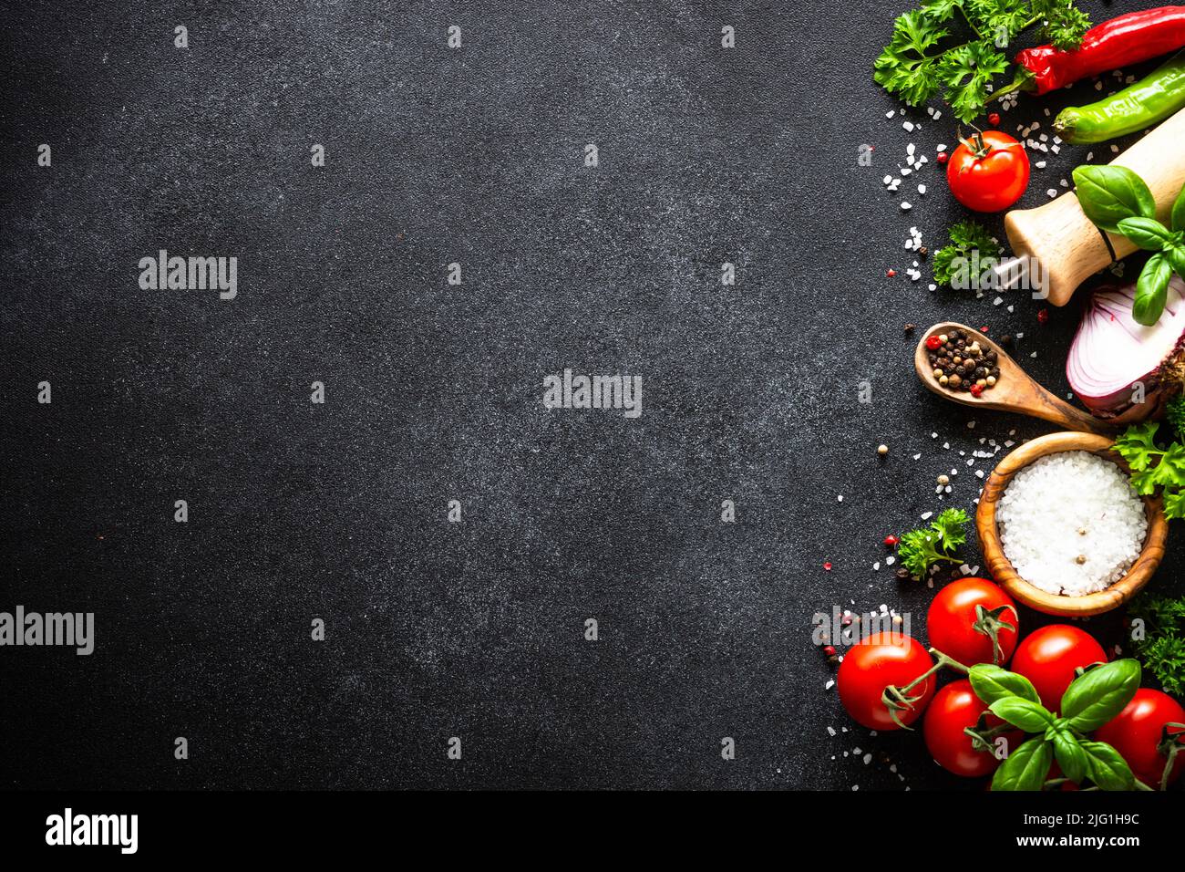 Food cooking background on black stone table Stock Photo - Alamy