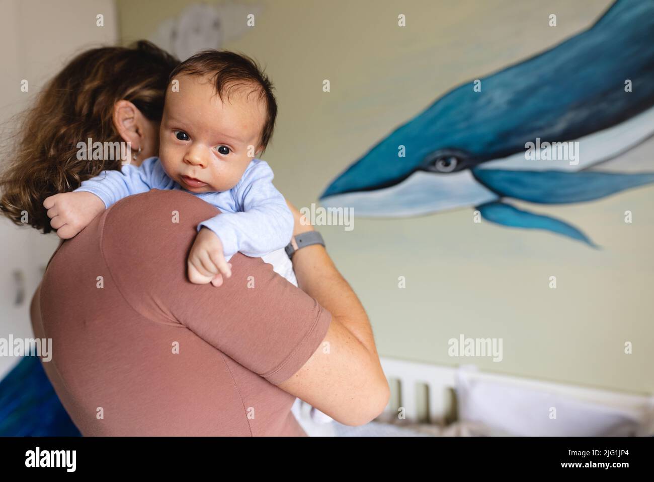 Family father mother carrying baby hi-res stock photography and images ...
