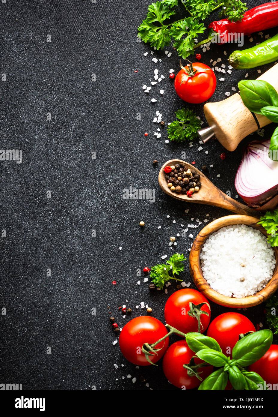 Food cooking background on black stone table Stock Photo - Alamy