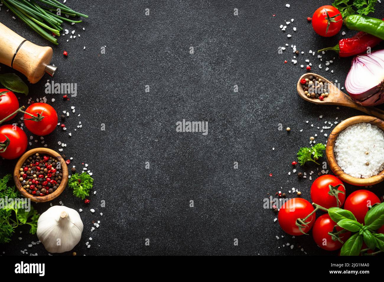 Food cooking background on black stone table Stock Photo - Alamy