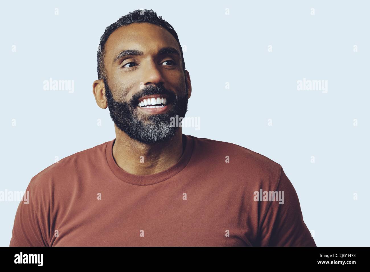 headshot portrait of a handsome bearded mid adult man smiling looking ...
