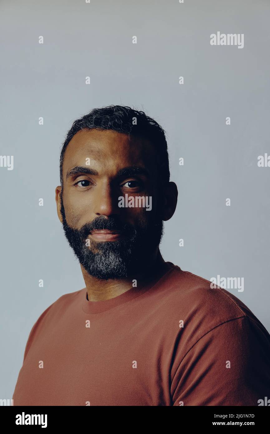 headshot portrait of a handsome thoughtful bearded mid adult man ...