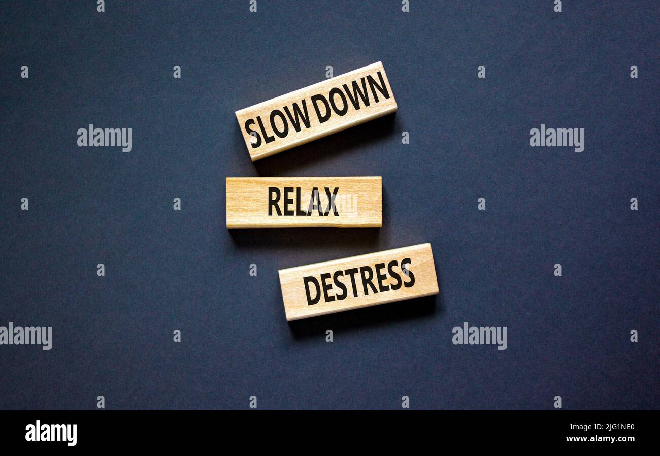 Destress symbol. Concept words Slow down Relax Destress on wooden ...