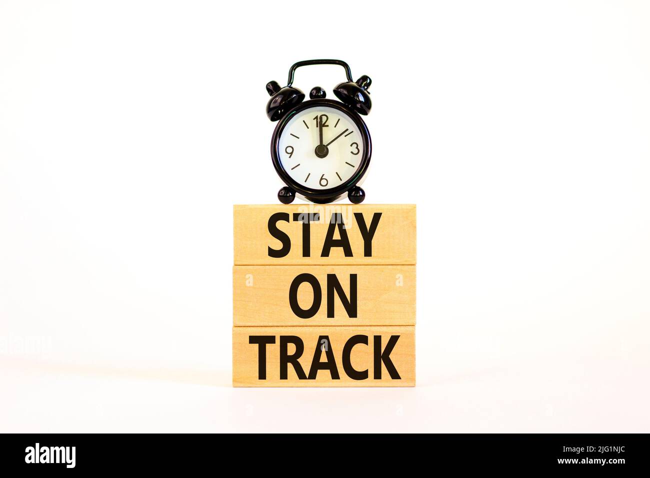 Stay on track symbol. Concept words Stay on track on wooden blocks on a ...