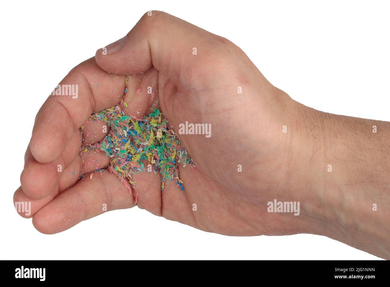 Side view of a hand holding microplastic. Holding microplastics in the ...
