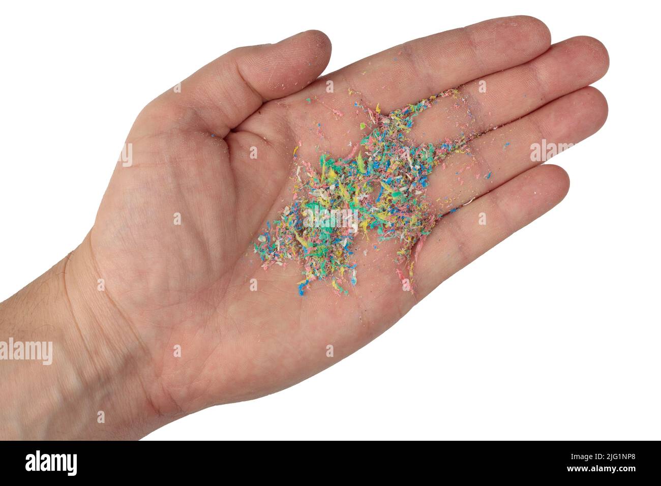 Micro plastic on a man's hand, top photo. Dots of colored plastic on ...