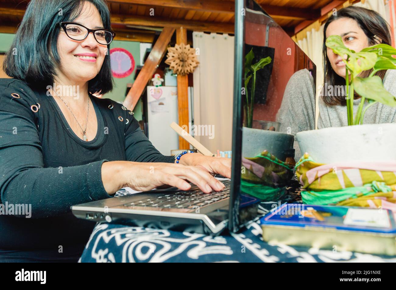 adult latin caucasian naturopathic doctor woman, sitting in her office ...