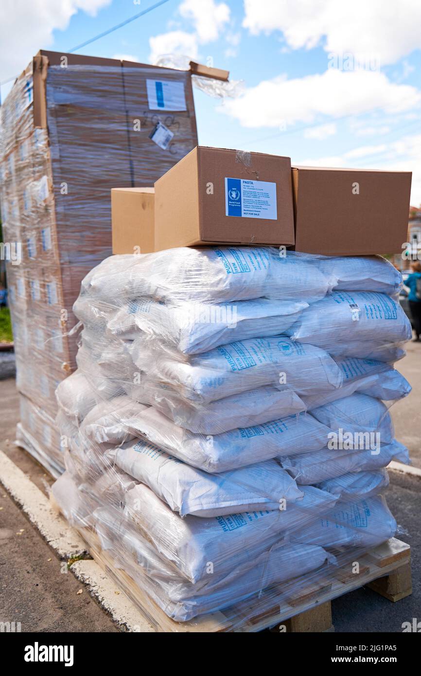Humanitarian food aid unloaded in front of humanitarian centre. Dnipro ...
