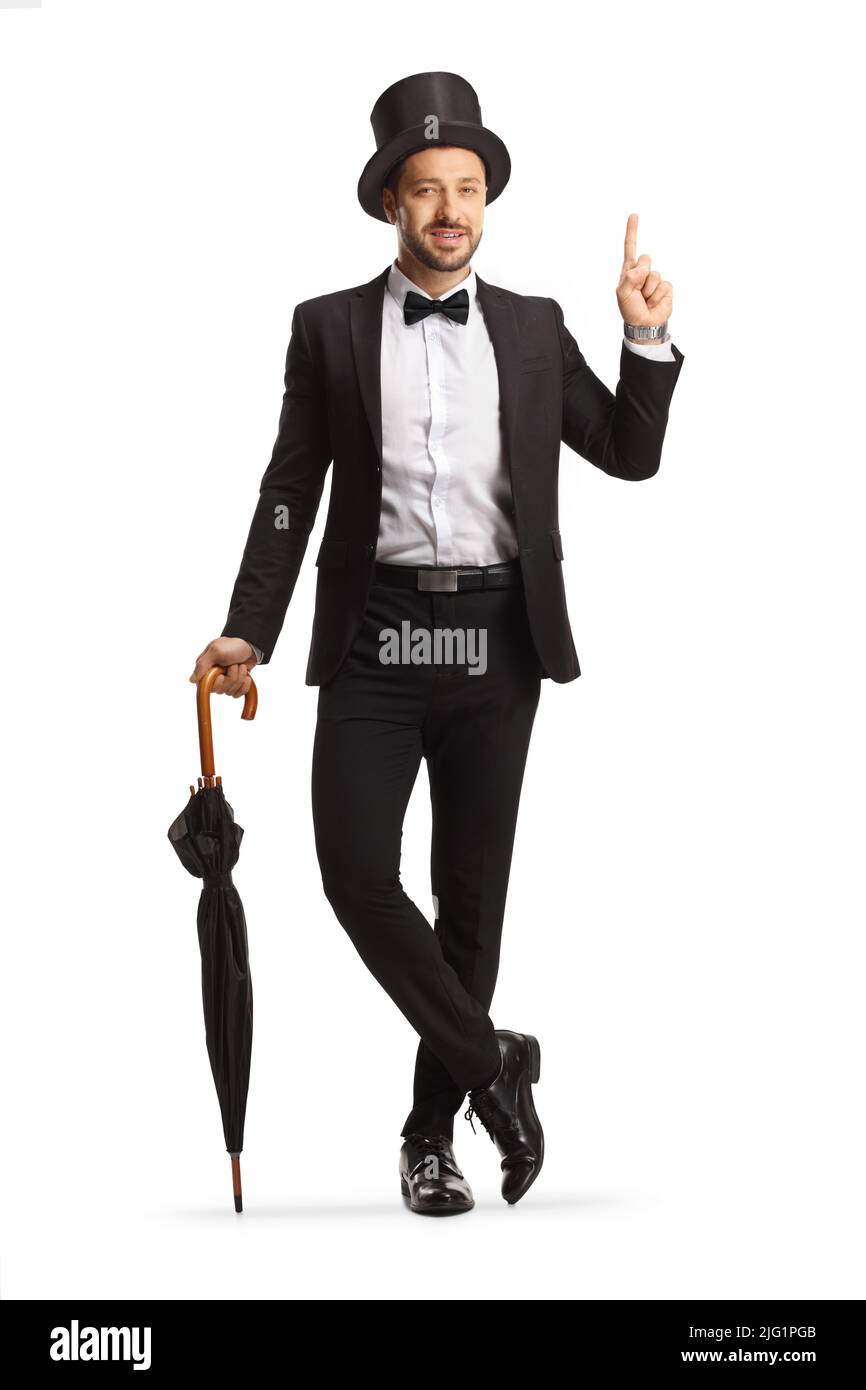 Full length portrait of a young gentleman with a top hat leaning on ...