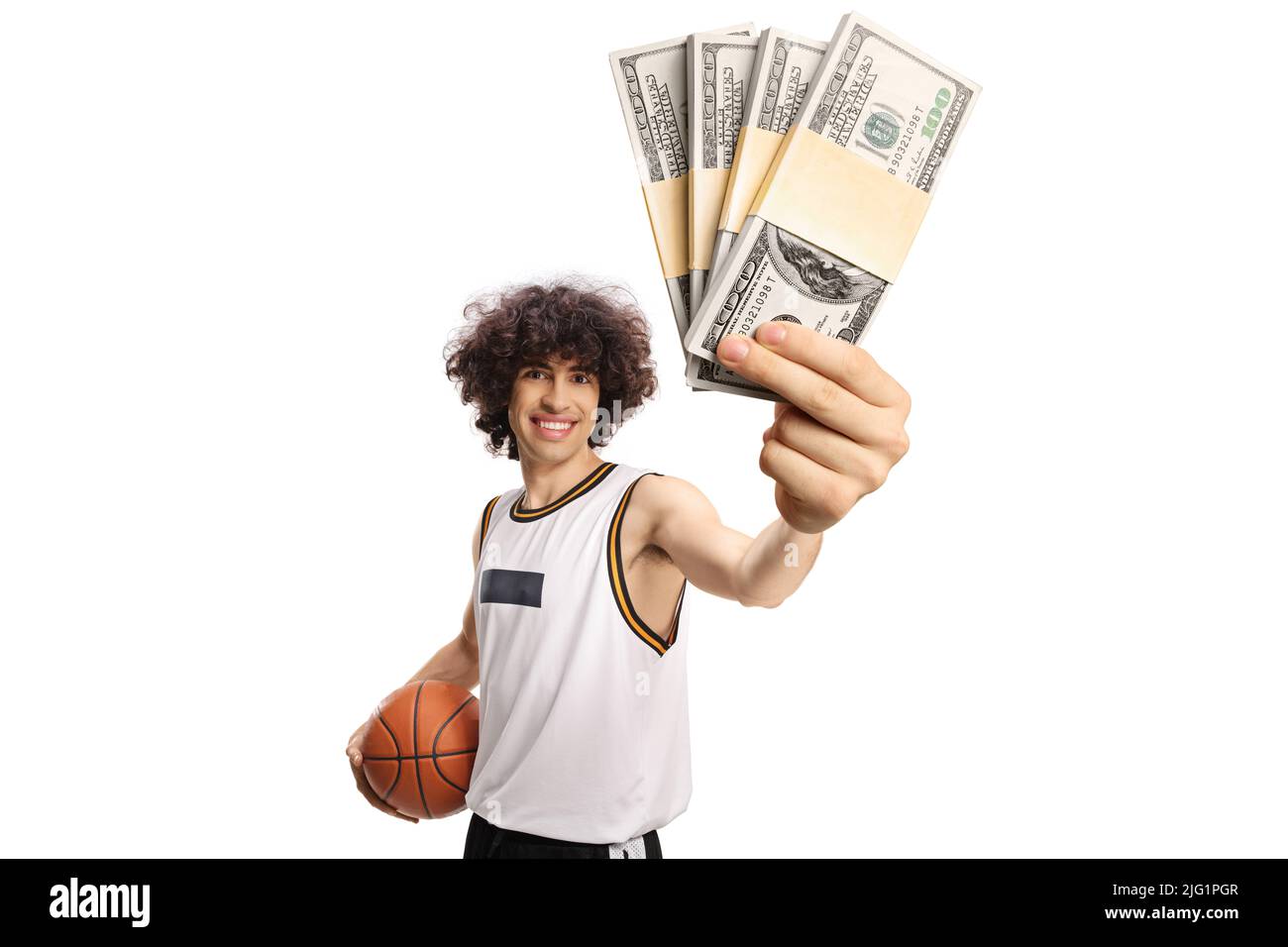 Basketball player holding a ball and money banknotes isolated on white ...