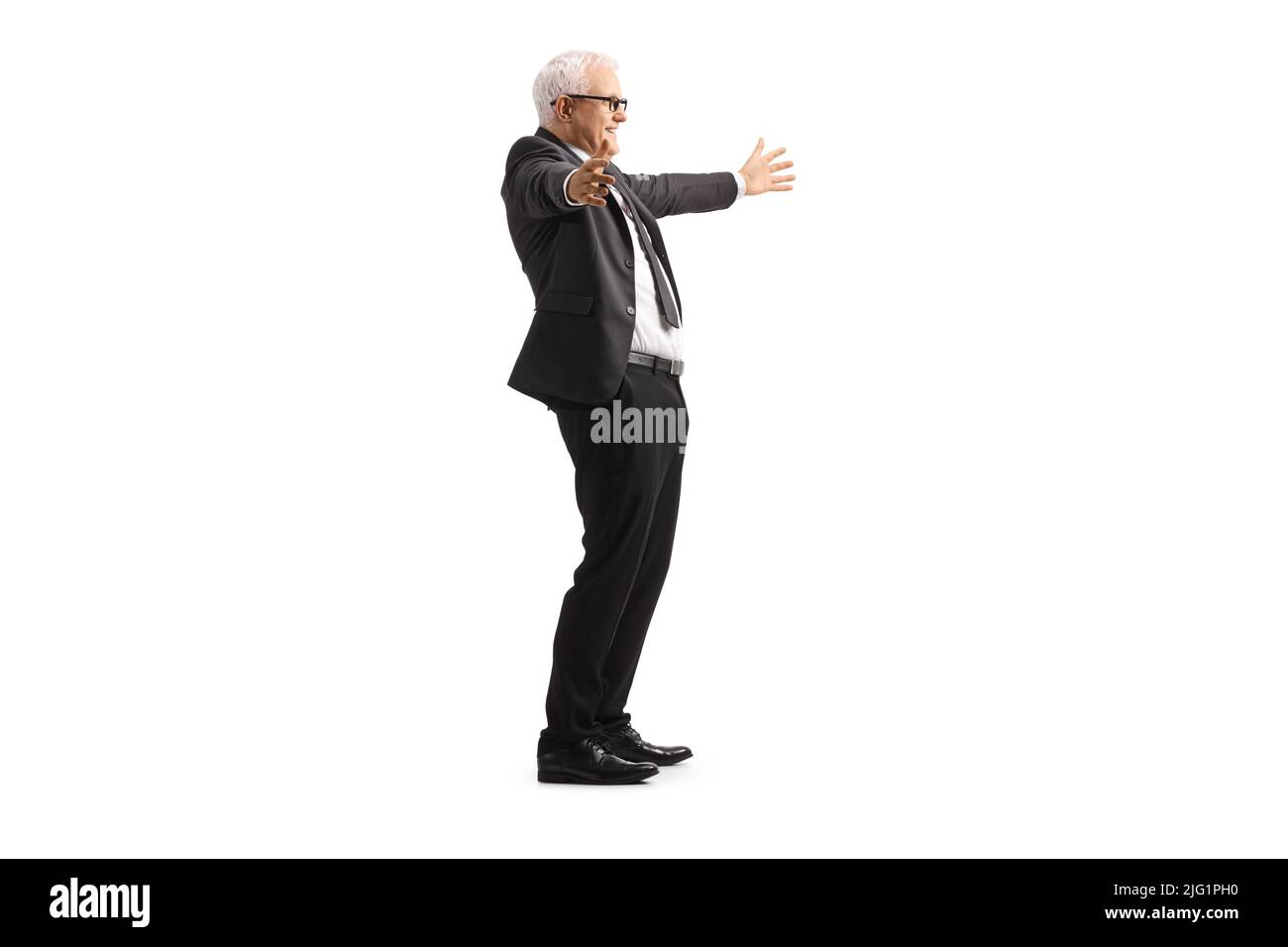 Full length profile shot of a mature businessman waiting someone with ...