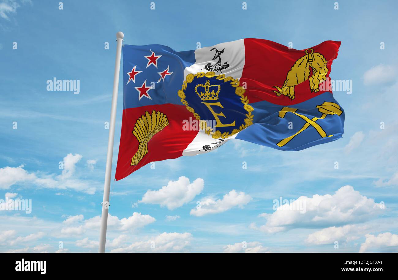 official flag of Royal Standard New Zealand at cloudy sky background on ...