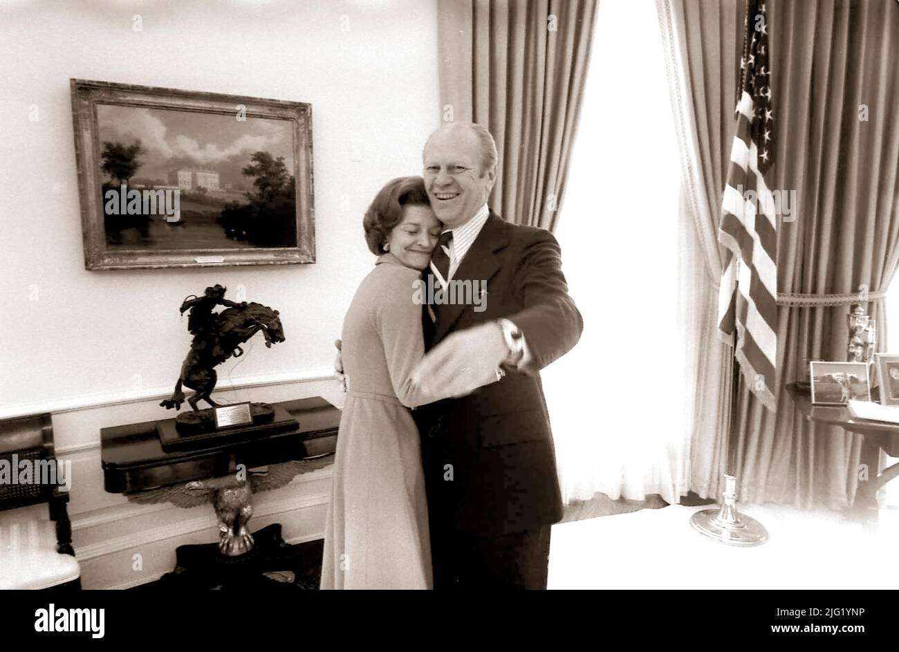President and Mrs. Ford hug each other in the Oval Office. December 6 ...