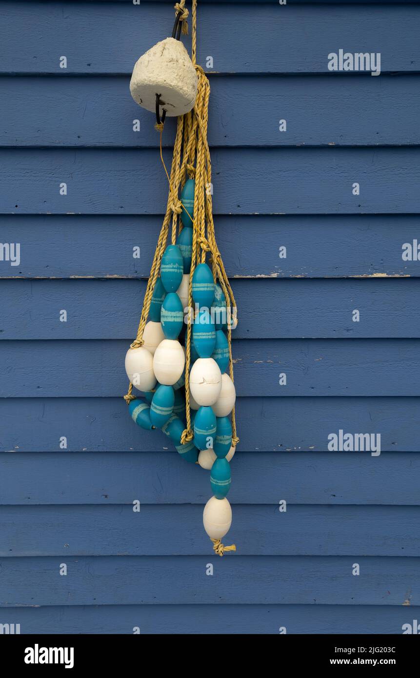 Net floats hanging on a wall at Petty Harbour Stock Photo - Alamy