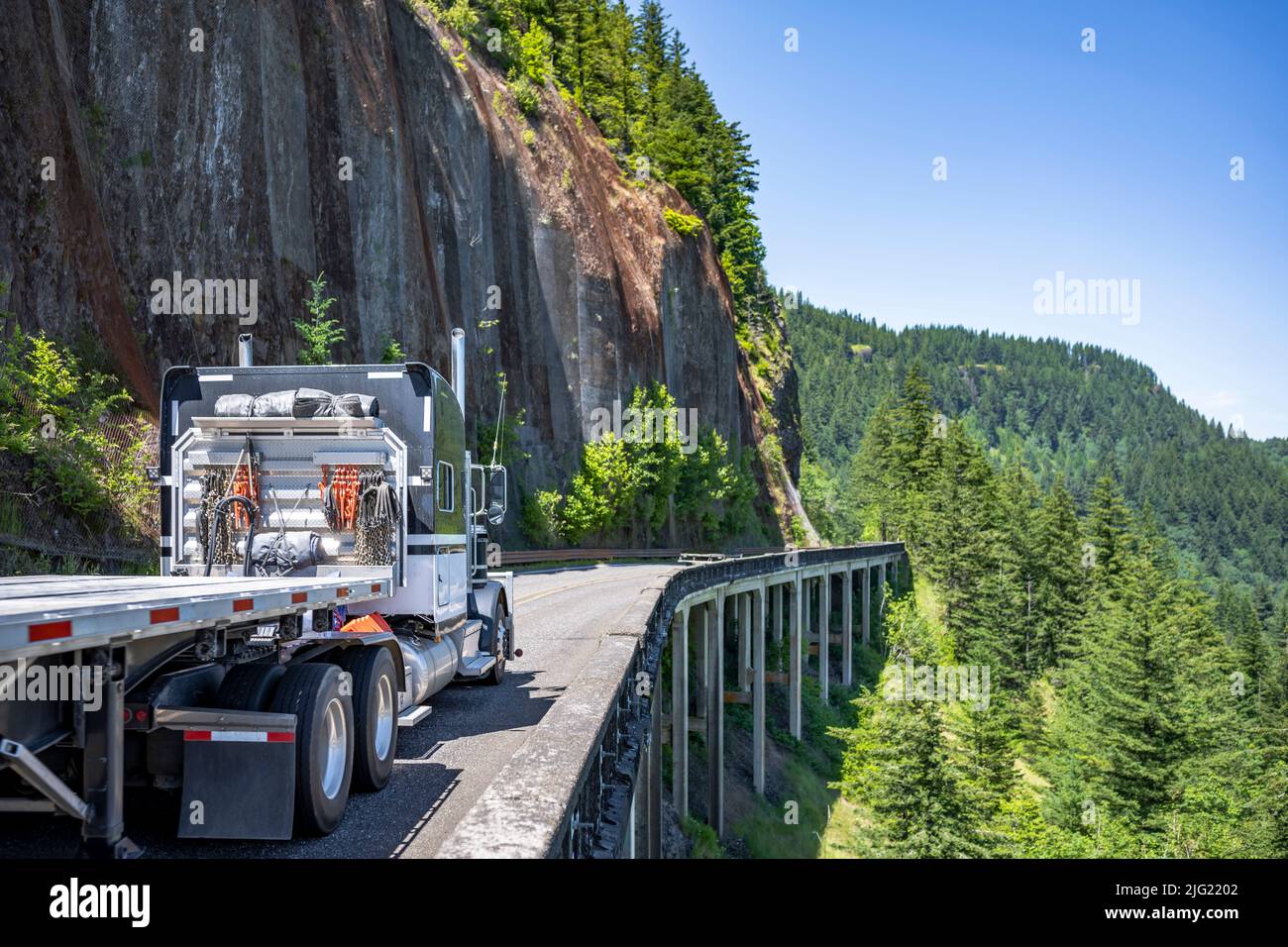Powerful black bonnet American classic big rig semi truck tractor with ...