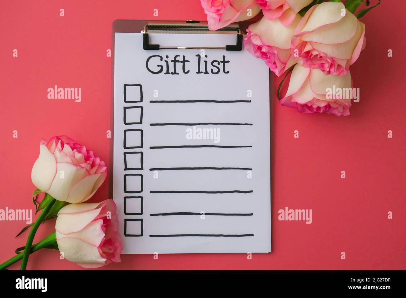 GIFT LIST on paper note. Delicate pink roses on pink background ...